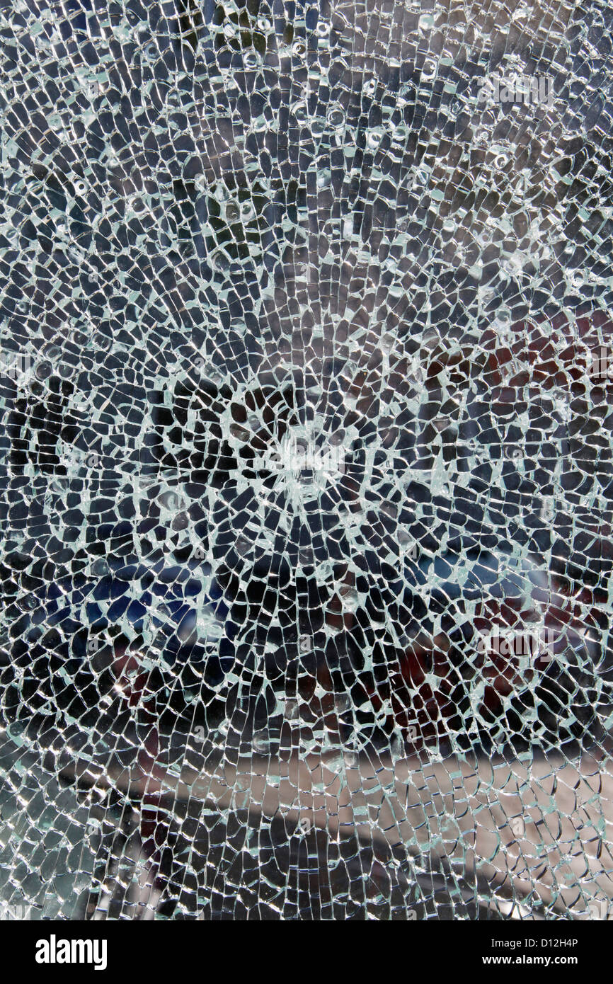Broken glass window on telephone box, close up Stock Photo - Alamy
