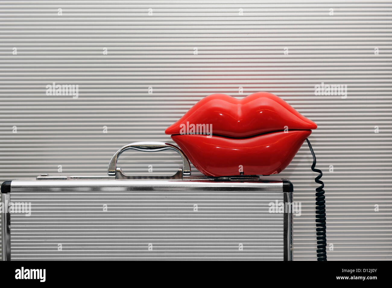 Lip shaped telephone on briefcase hi-res stock photography and images ...