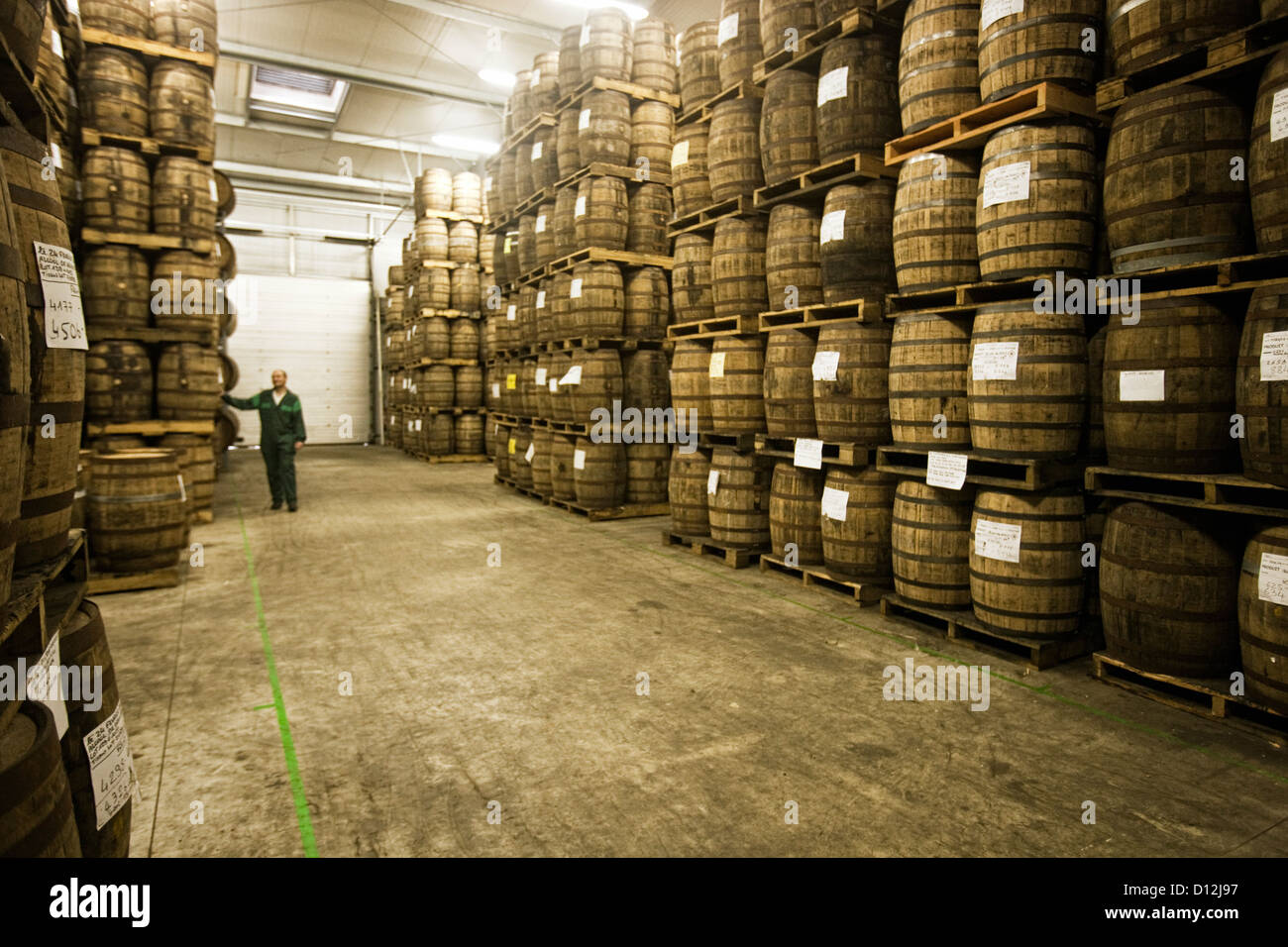 A worker counts whisky casks in the warehouse at the Warengham ...