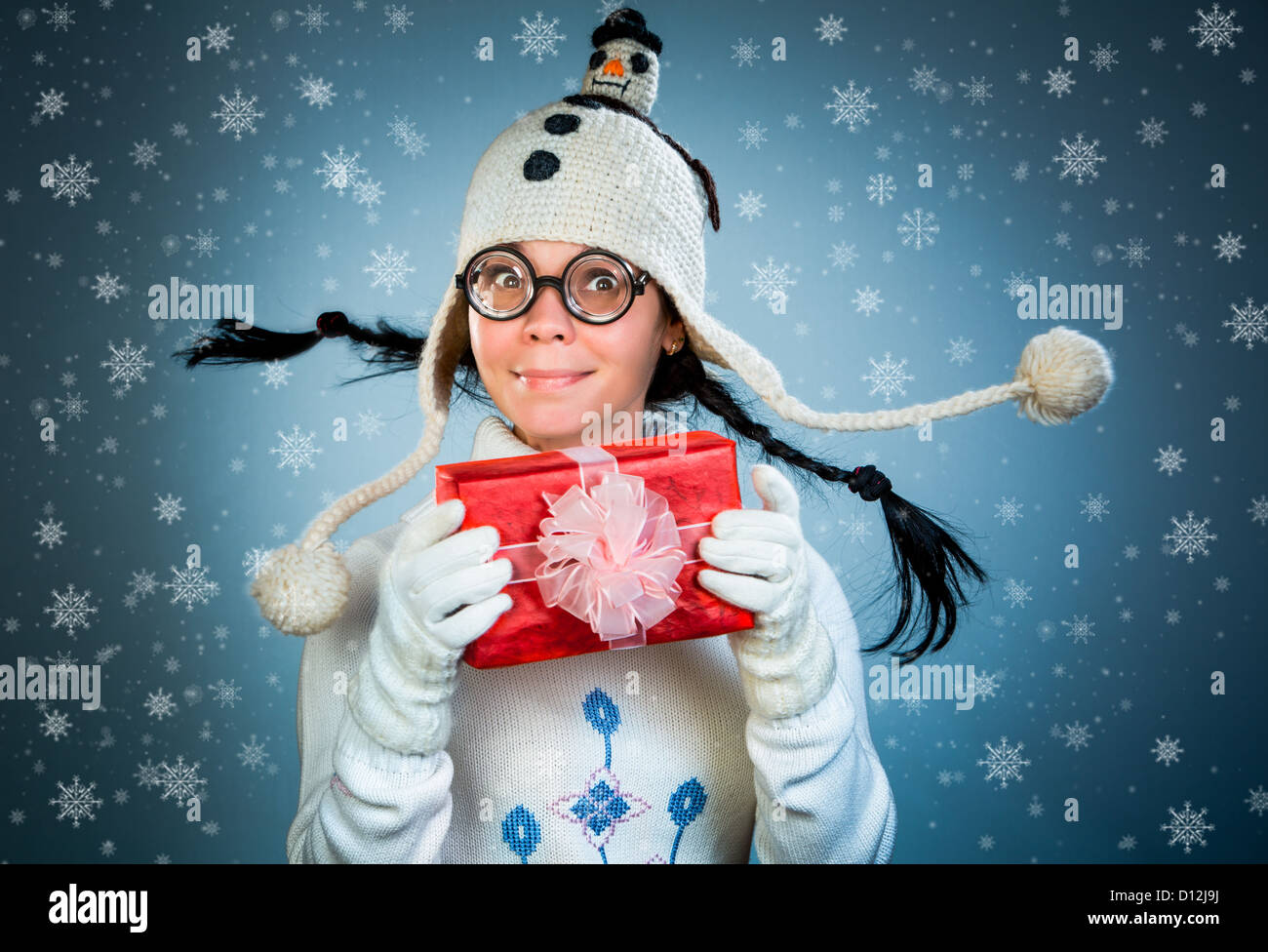 Funny girl with a gift in their hands Stock Photo - Alamy