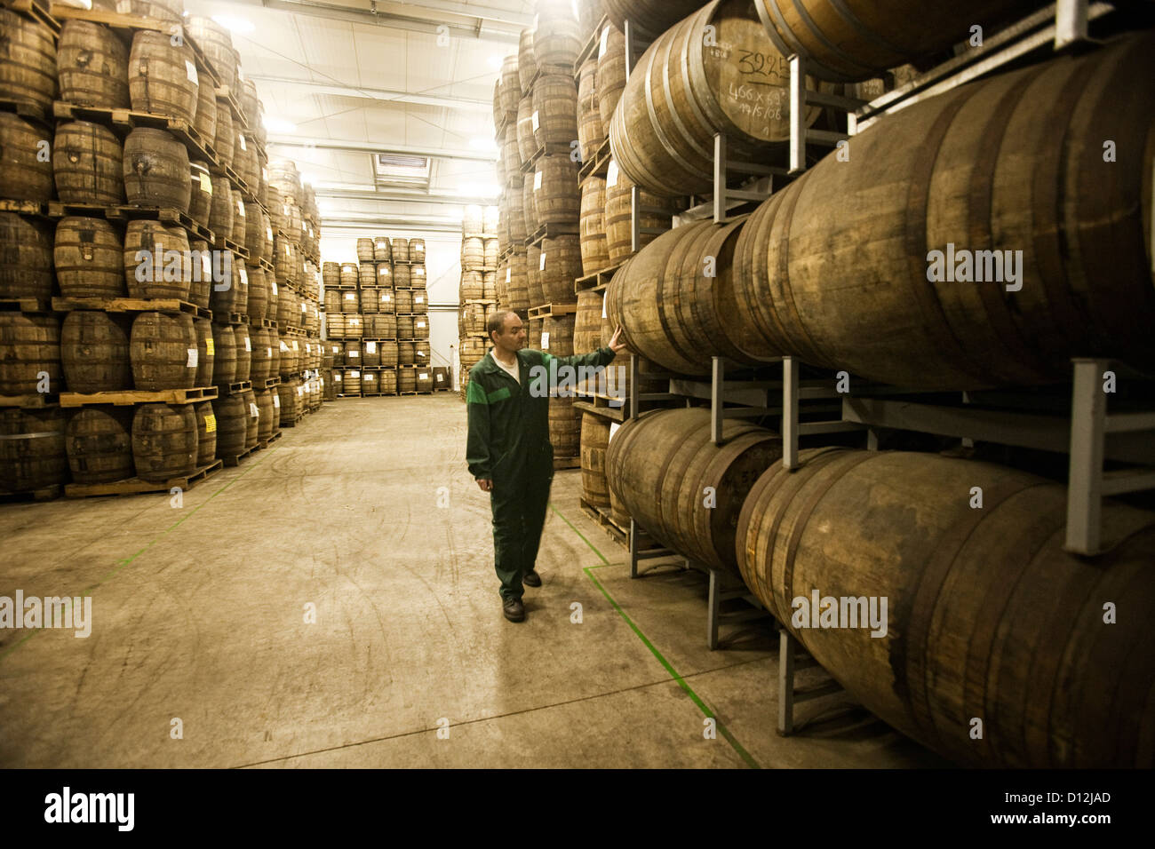 A worker counts whisky casks in the warehouse at the Warengham ...