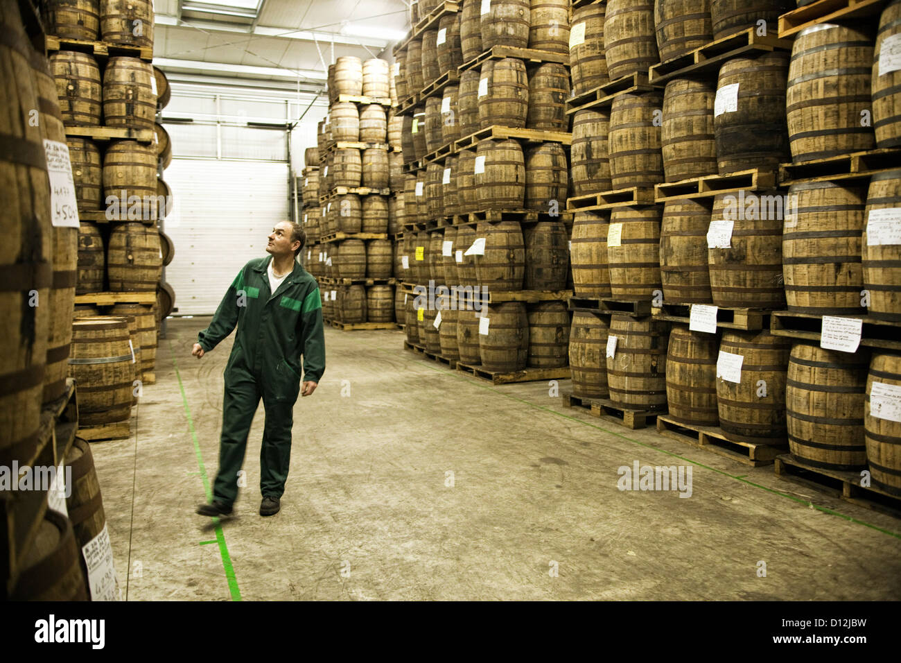A worker counts whisky casks in the warehouse at the Warengham ...
