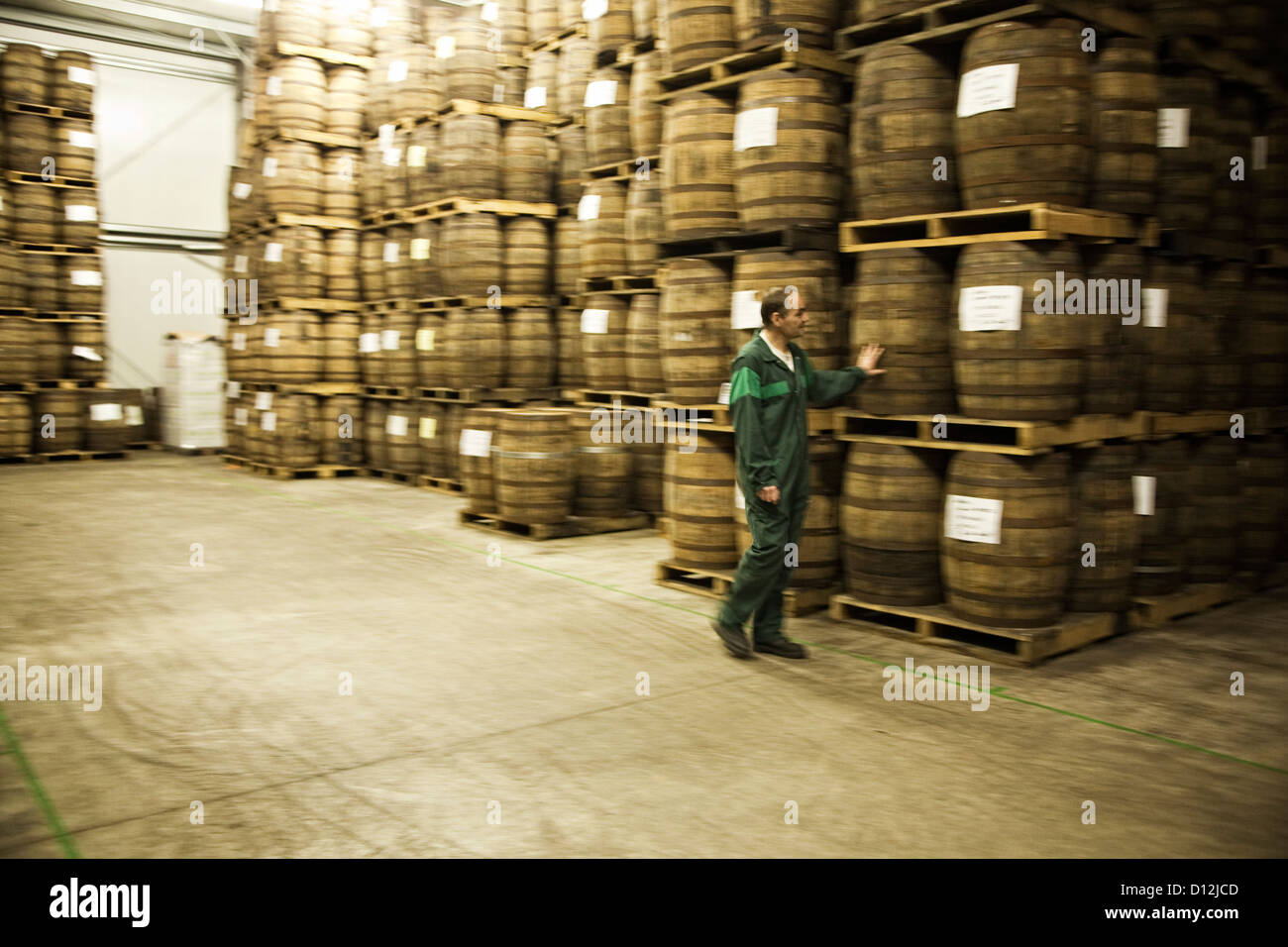 A worker counts whisky casks in the warehouse at the Warengham ...