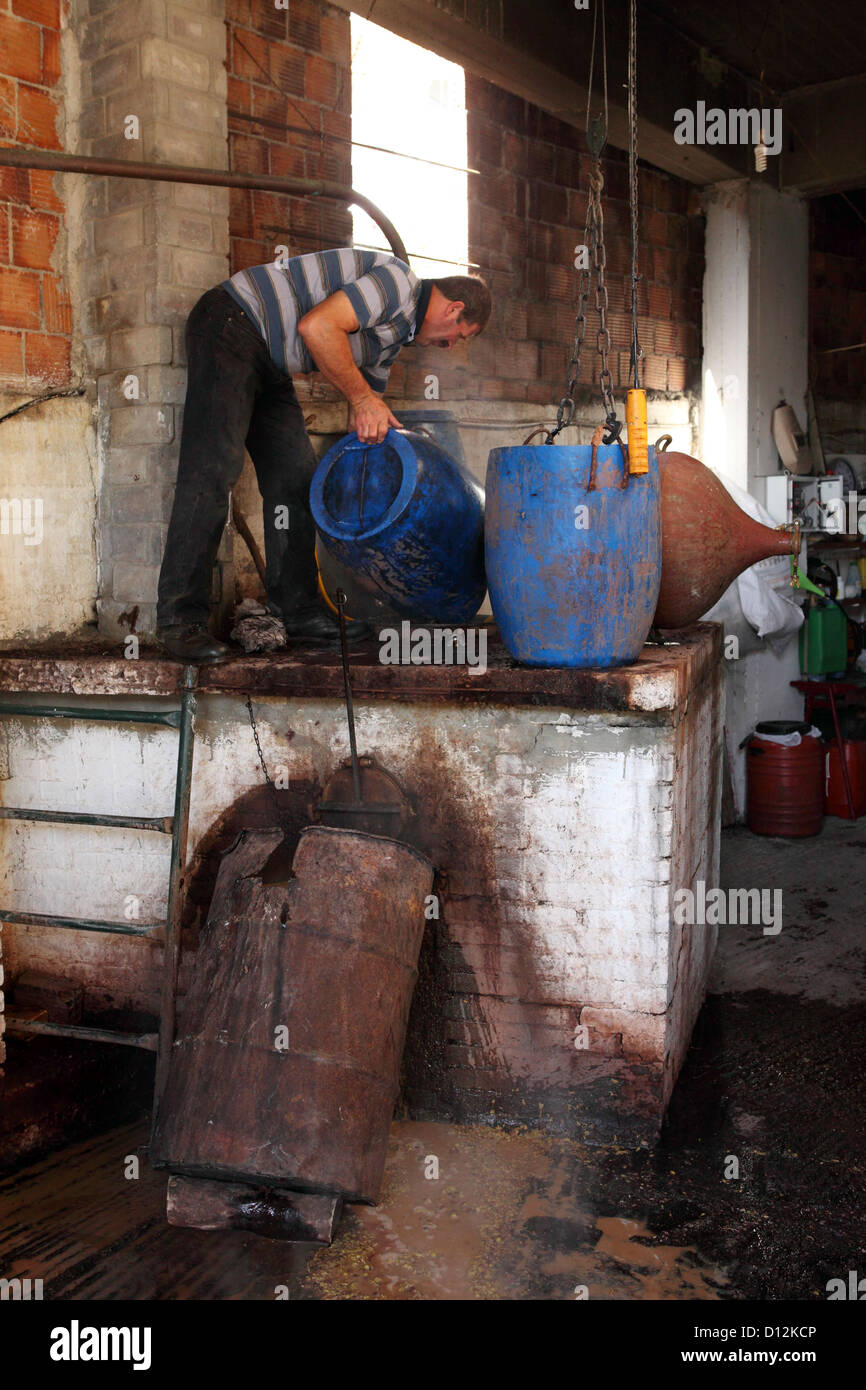 A Raki producer at work in his distillery in a village close to Spili ...