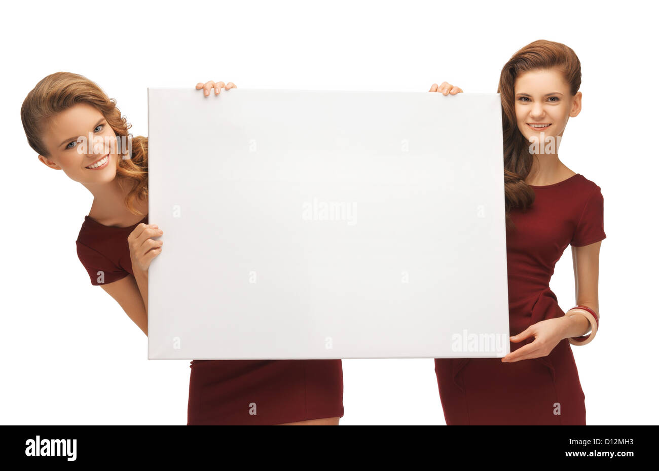 two teenage girls in red dresses with blank board Stock Photo - Alamy