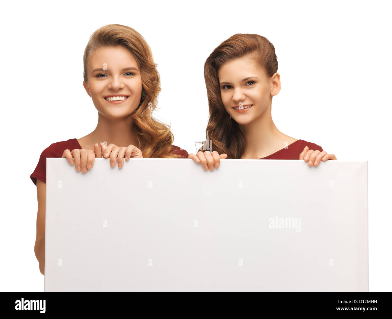 two teenage girls in red dresses with blank board Stock Photo - Alamy