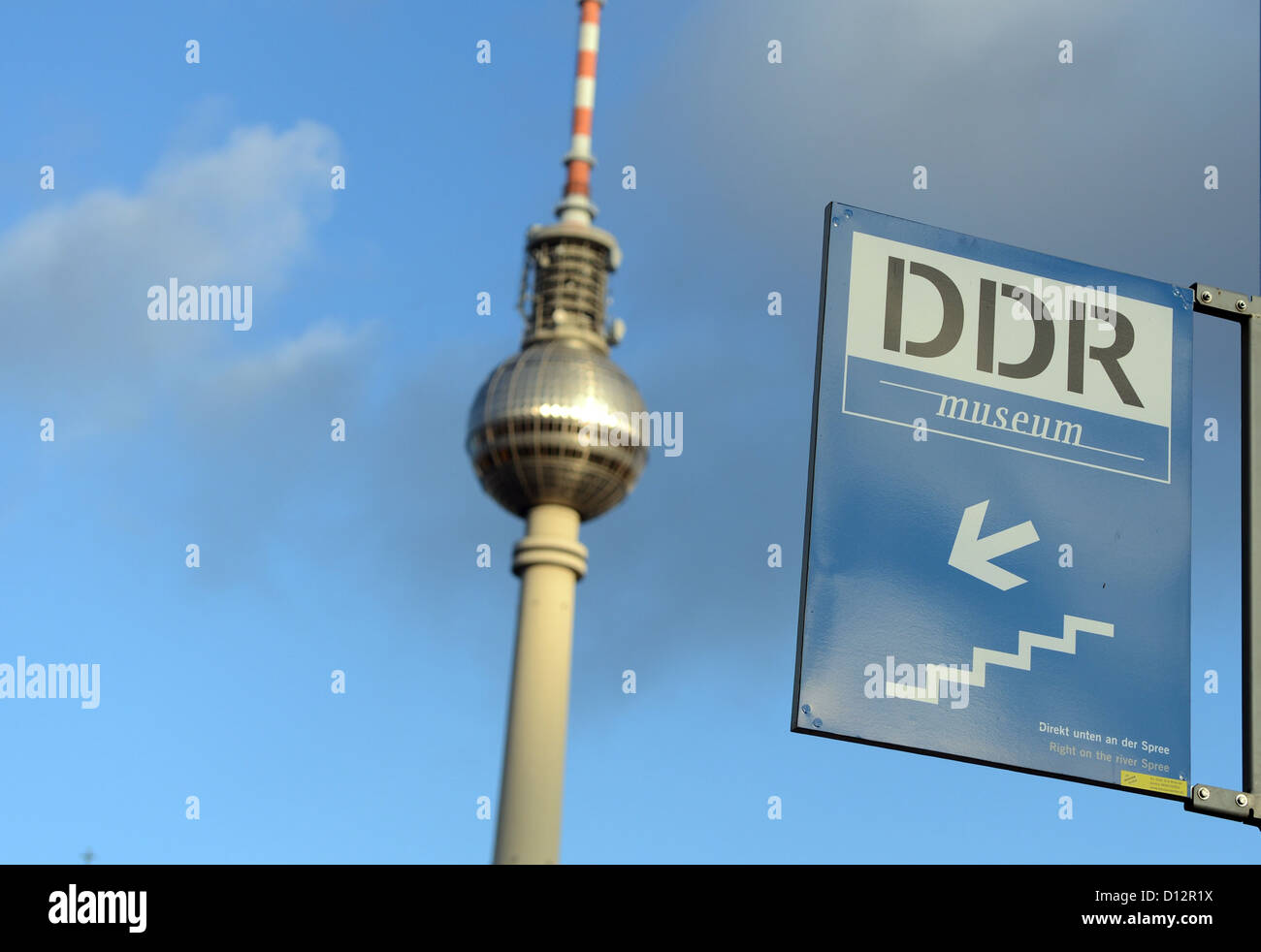 A street sign showing the way to the DDR Museum (GDR Museum) is ...