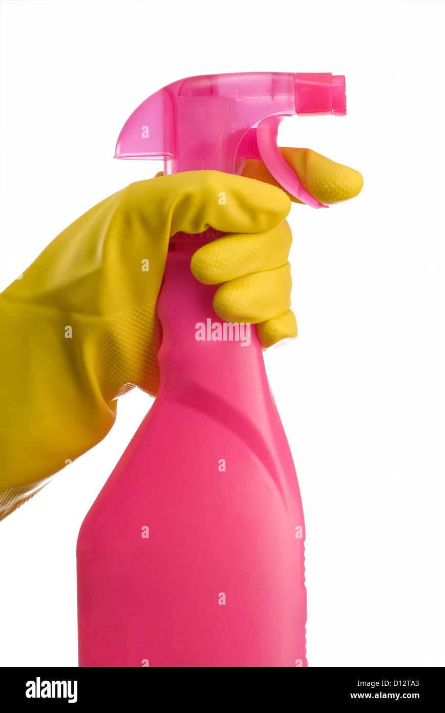 Pink cleaning bottle with janitor or housewife hand in yellow glove ...