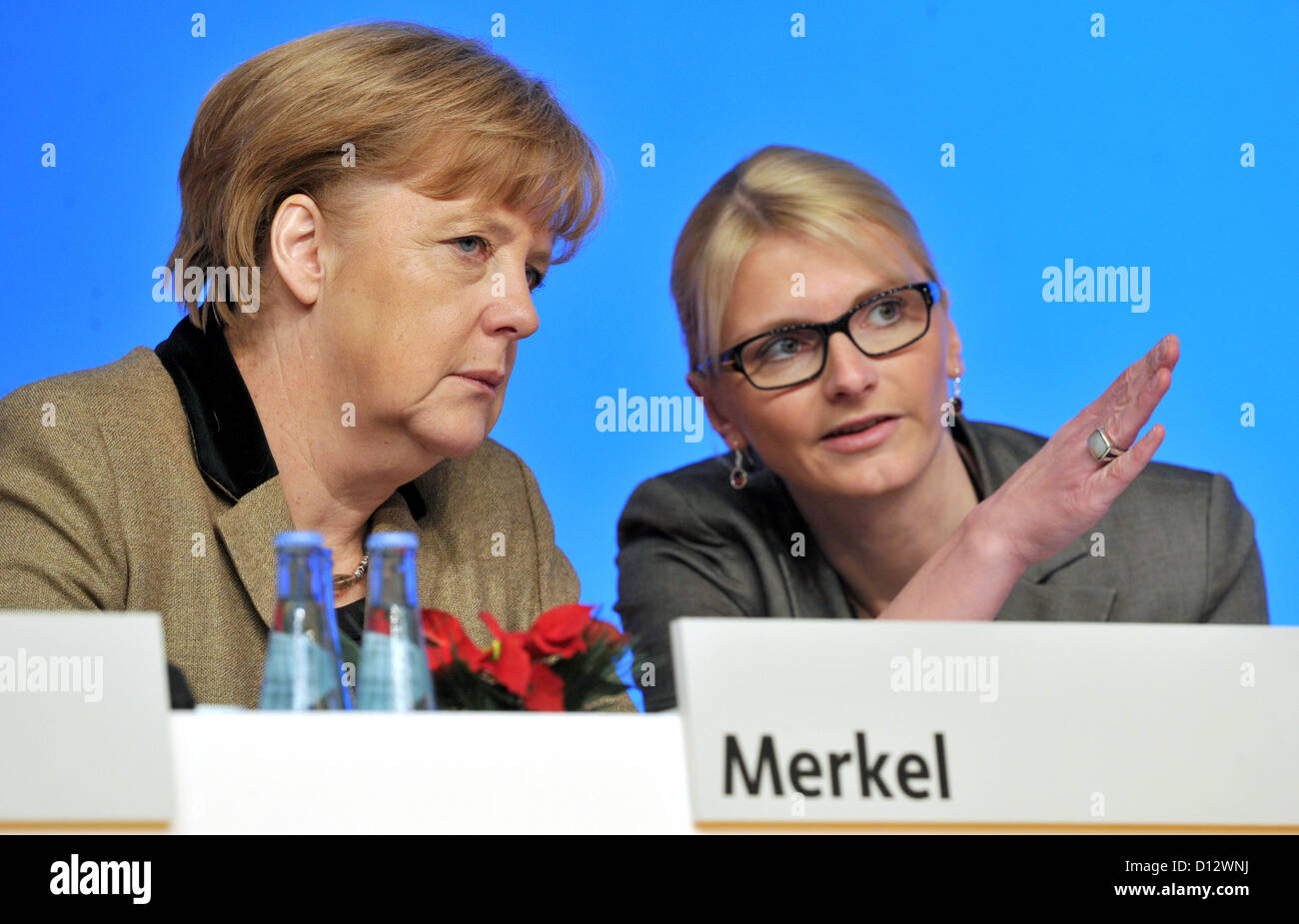 German Chancellor Angela Merkel (L) talks to CDU spokesperson Eva ...