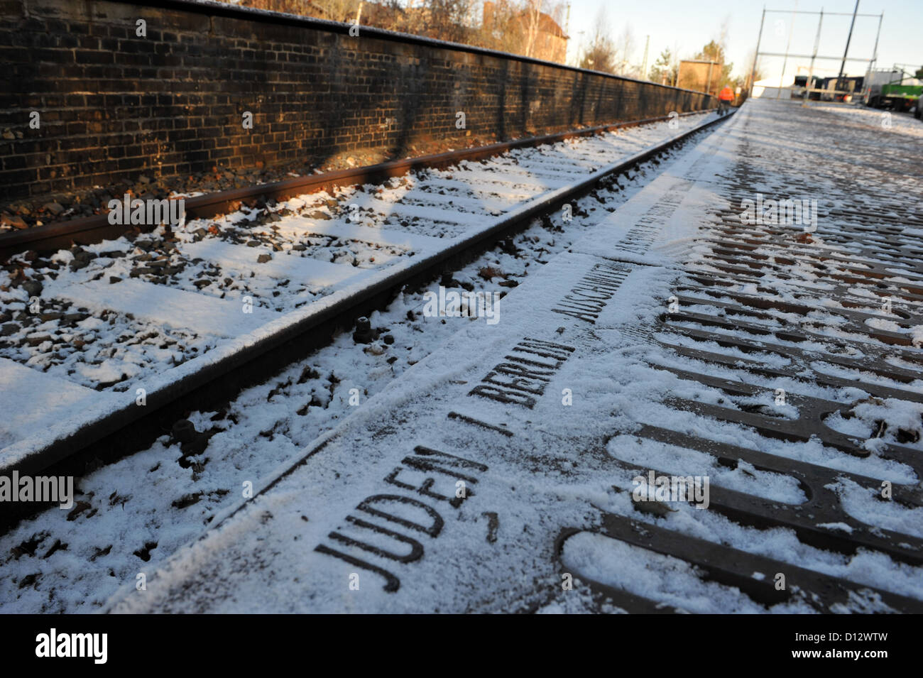 The inscription 'Jews Berlin-Auschwitz' is lightly covered in snow at ...