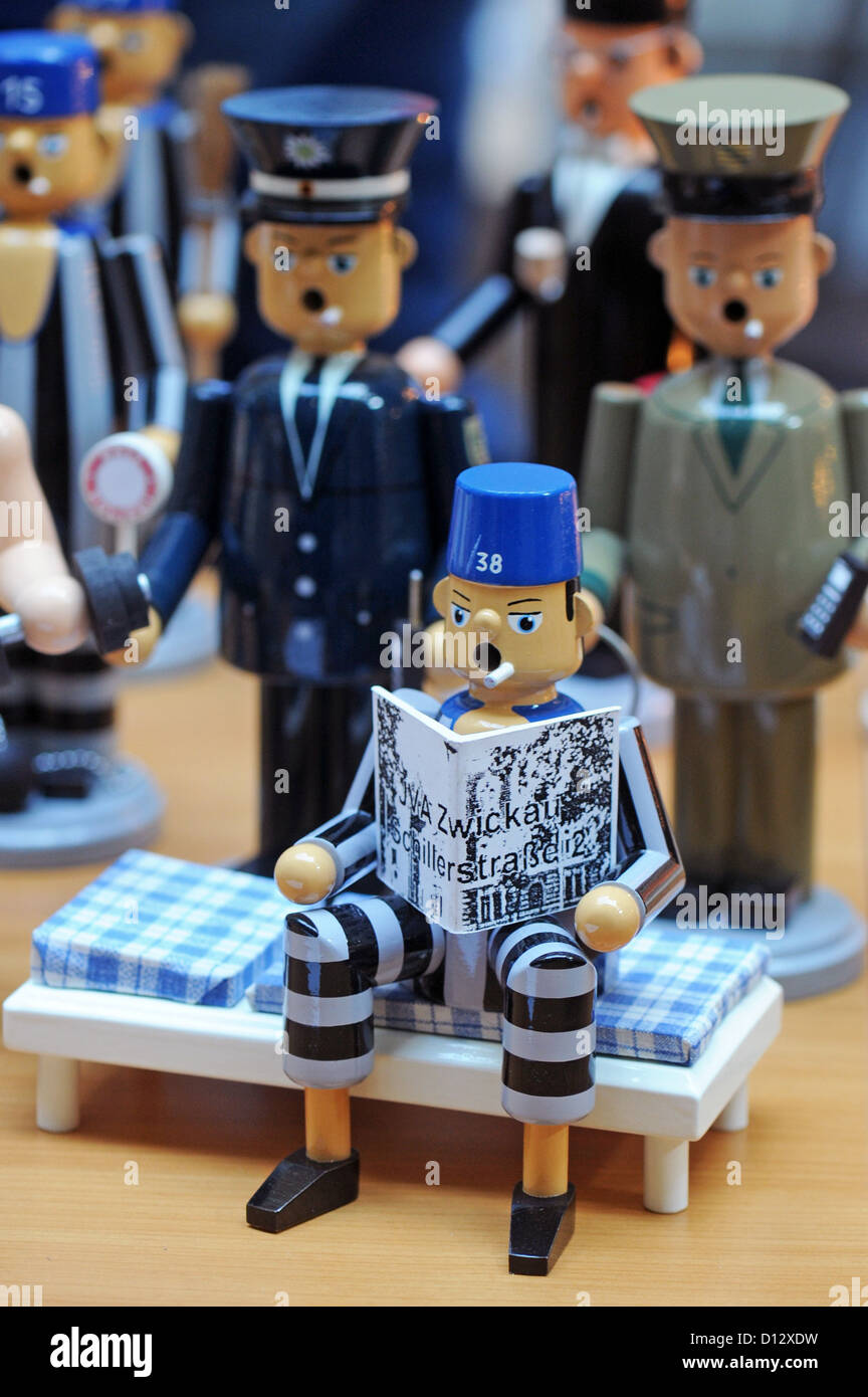 Traditional wooden incense figures and nutcrackers are pictured at the ...