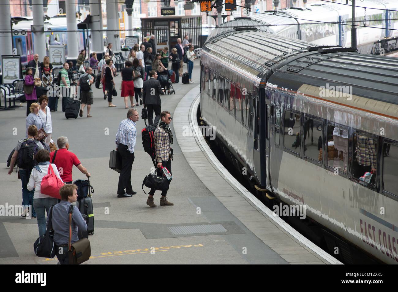 People waiting to board an East Coast Main Line train at York Railway ...