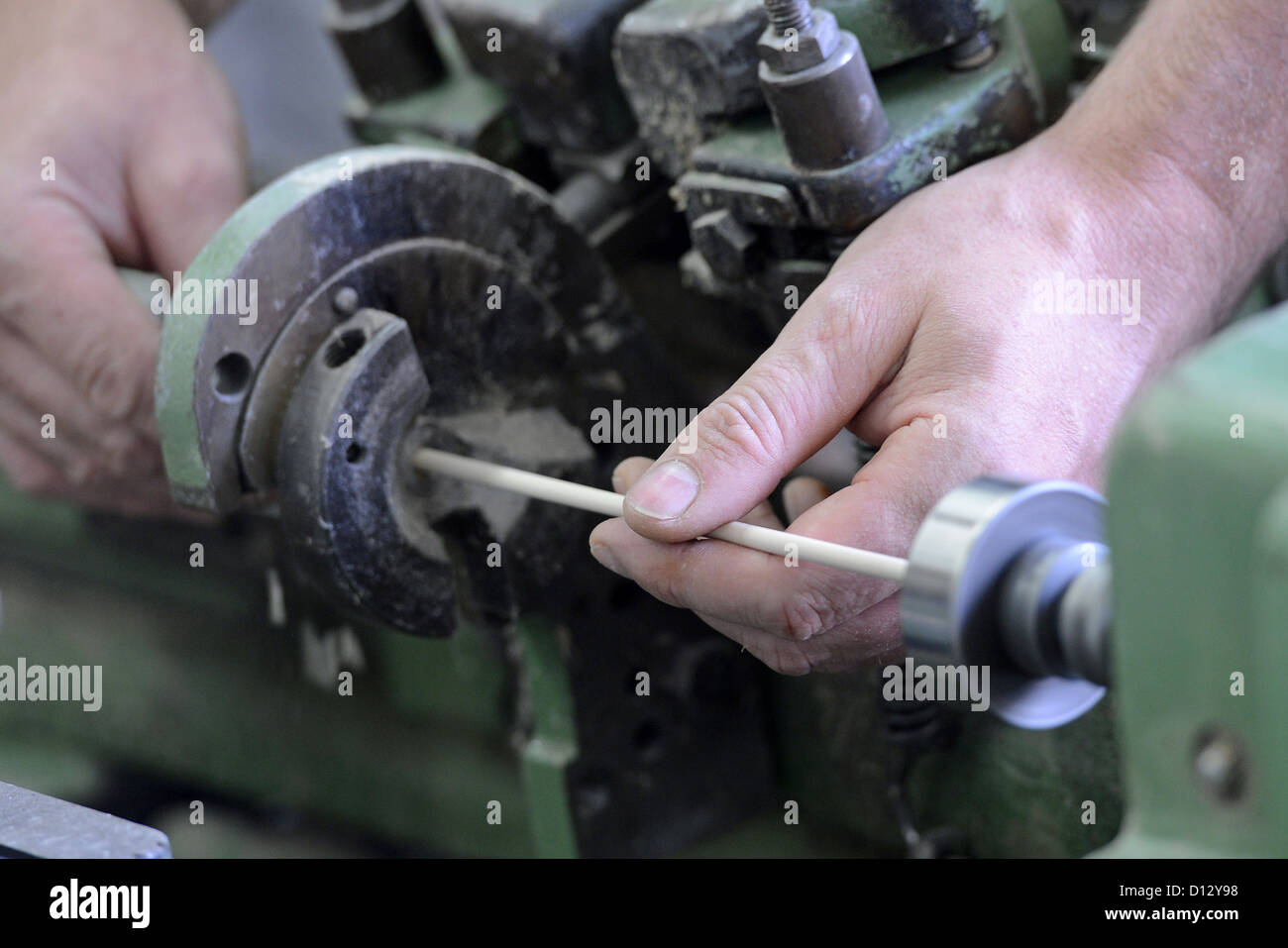 Wound wooden sticks and handles for batons are produced at the baton ...