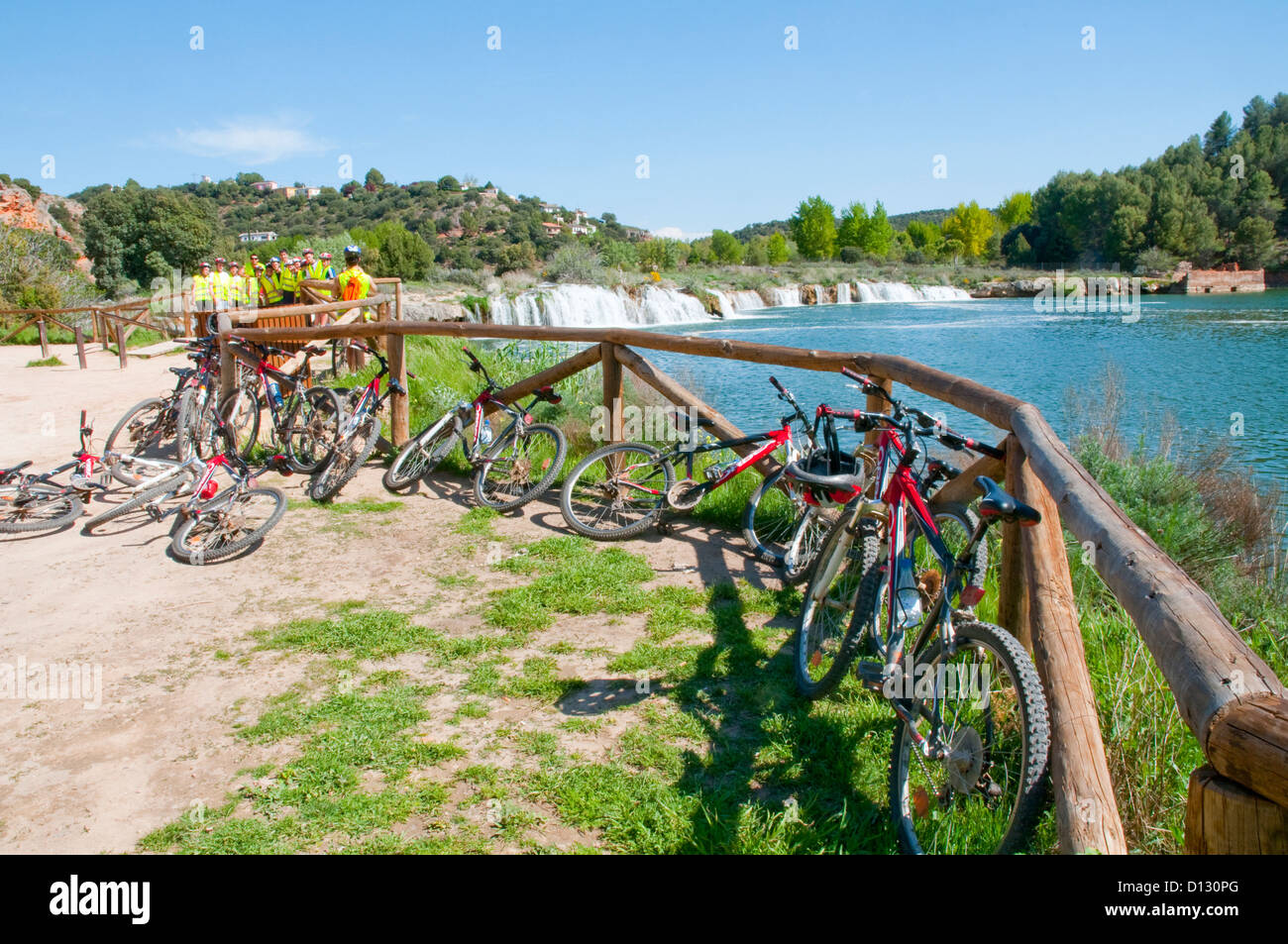 Group of cyclists at La Colgada lake. Lagunas de Ruidera Nature Reserve ...