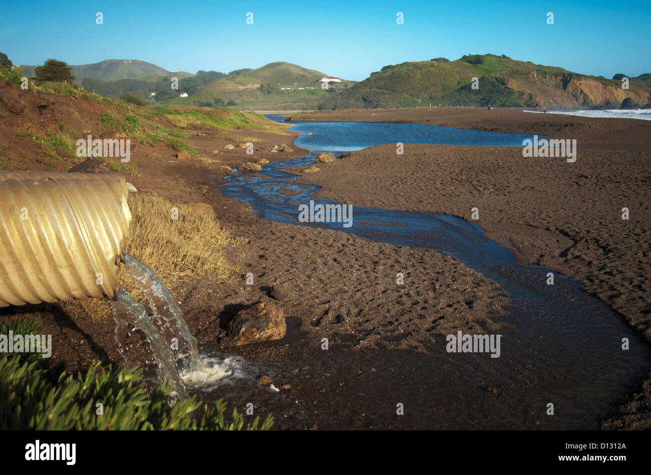 A Pipe Spills Water Out Into A Stream; Marin Headlands California ...