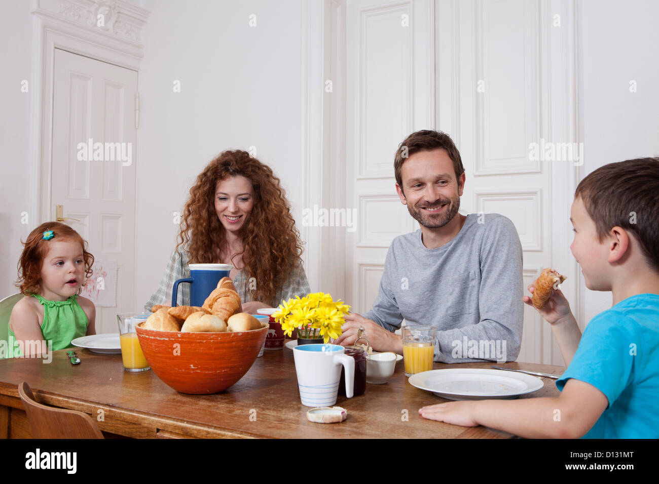 Germany, Berlin, Family having breakfast, smiling Stock Photo - Alamy