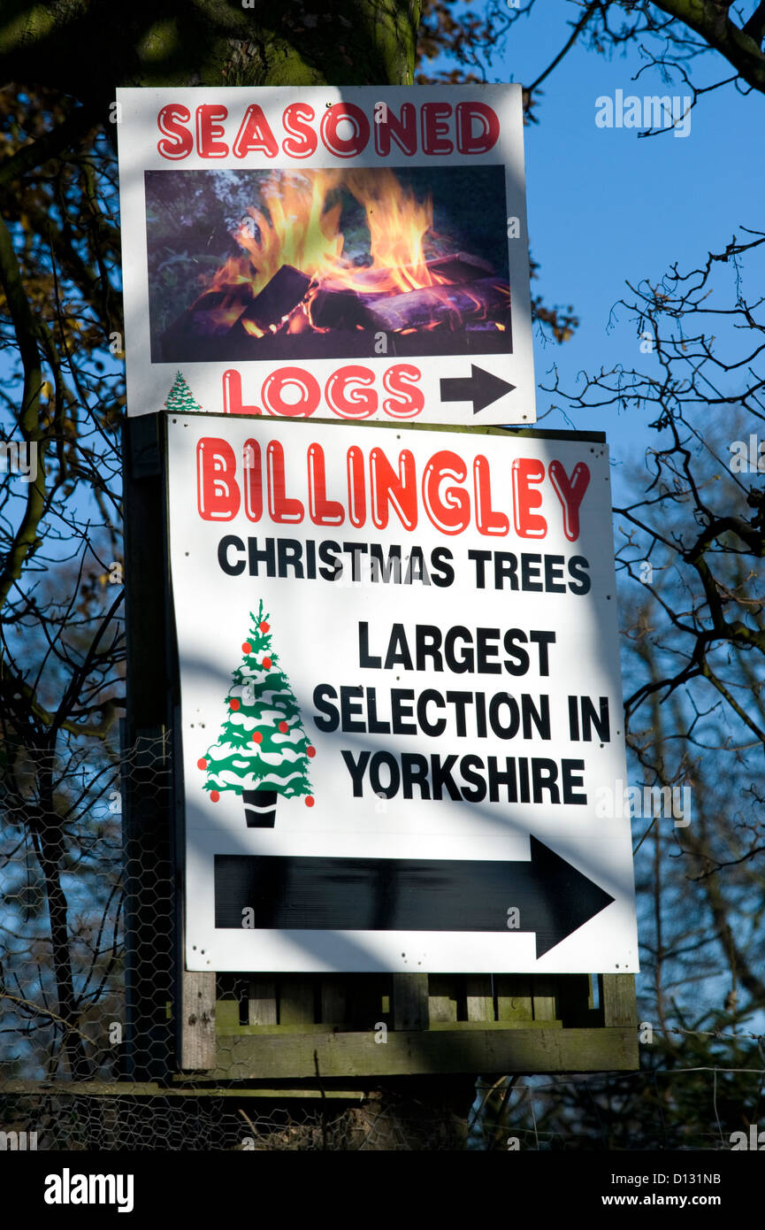 Sign for Christmas trees, and Logs Stock Photo - Alamy