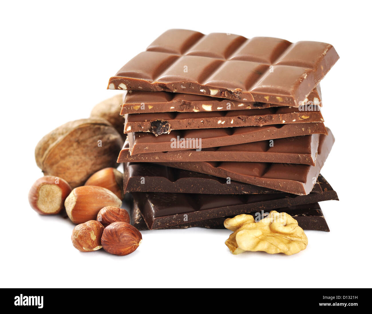 Close-up of stacked assorted chocolate with nuts isolated on white ...