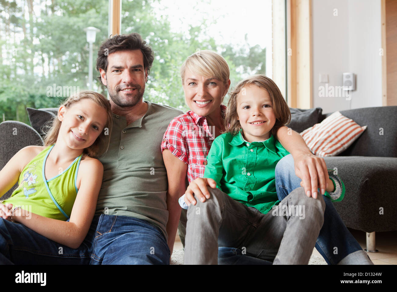 Germany, Bavaria, Nuremberg, Portrait of family in living room Stock ...