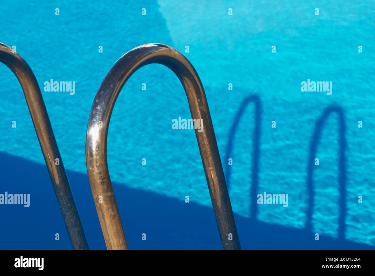 Ladder Into Swimming Pool With Shadow Of Ladder In The Water ...