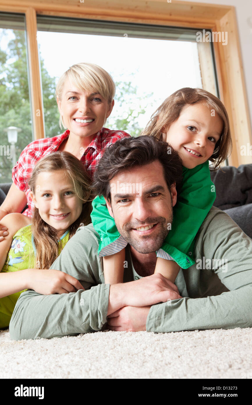 Germany, Bavaria, Nuremberg, Portrait of family in living room Stock ...