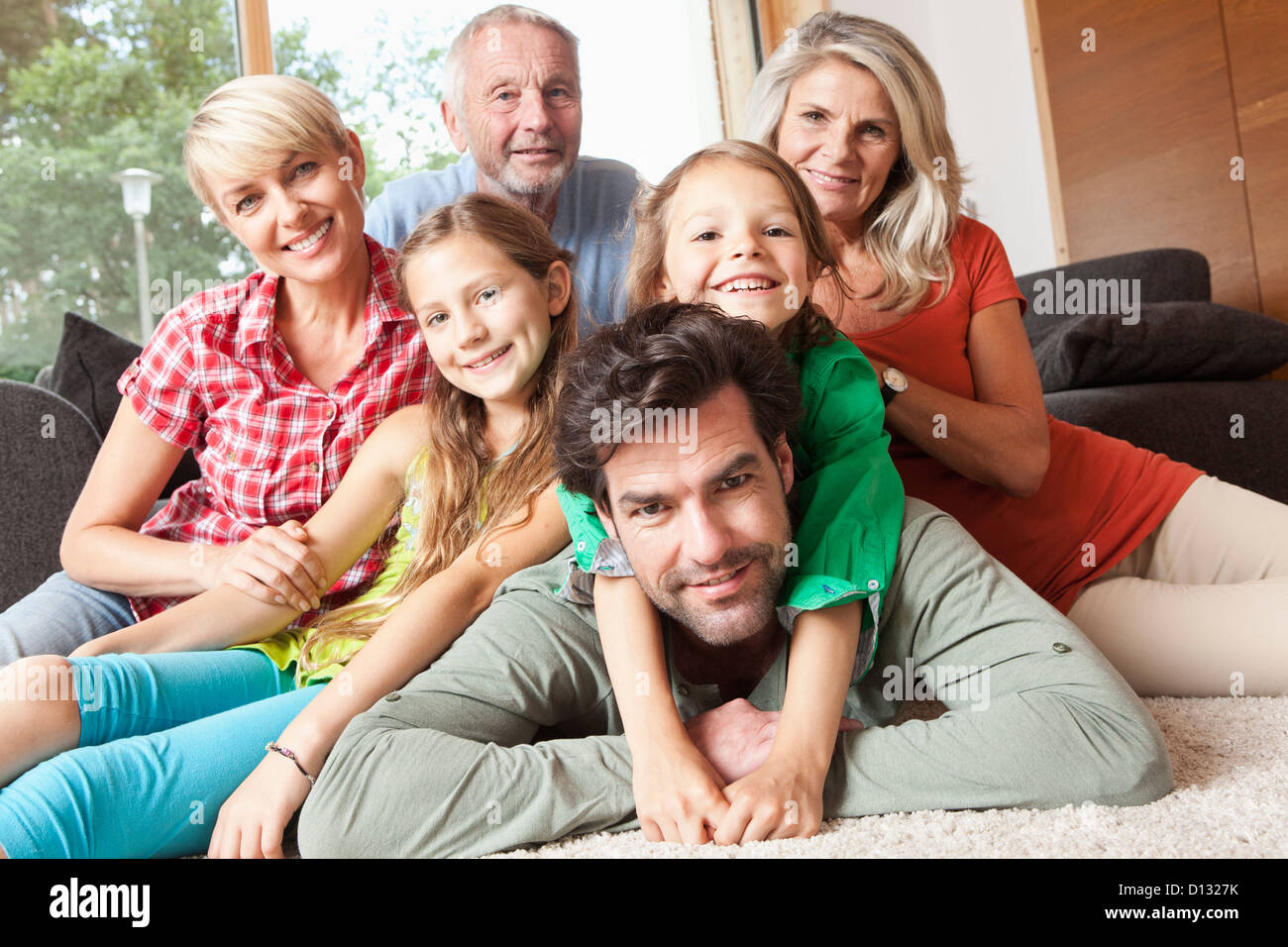 Germany, Bavaria, Nuremberg, Portrait of family in living room Stock ...