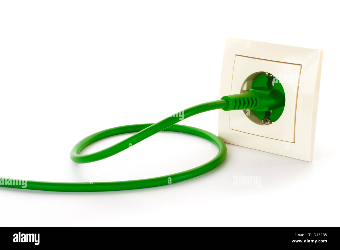 Green power plug into power outlet against a white background Stock ...