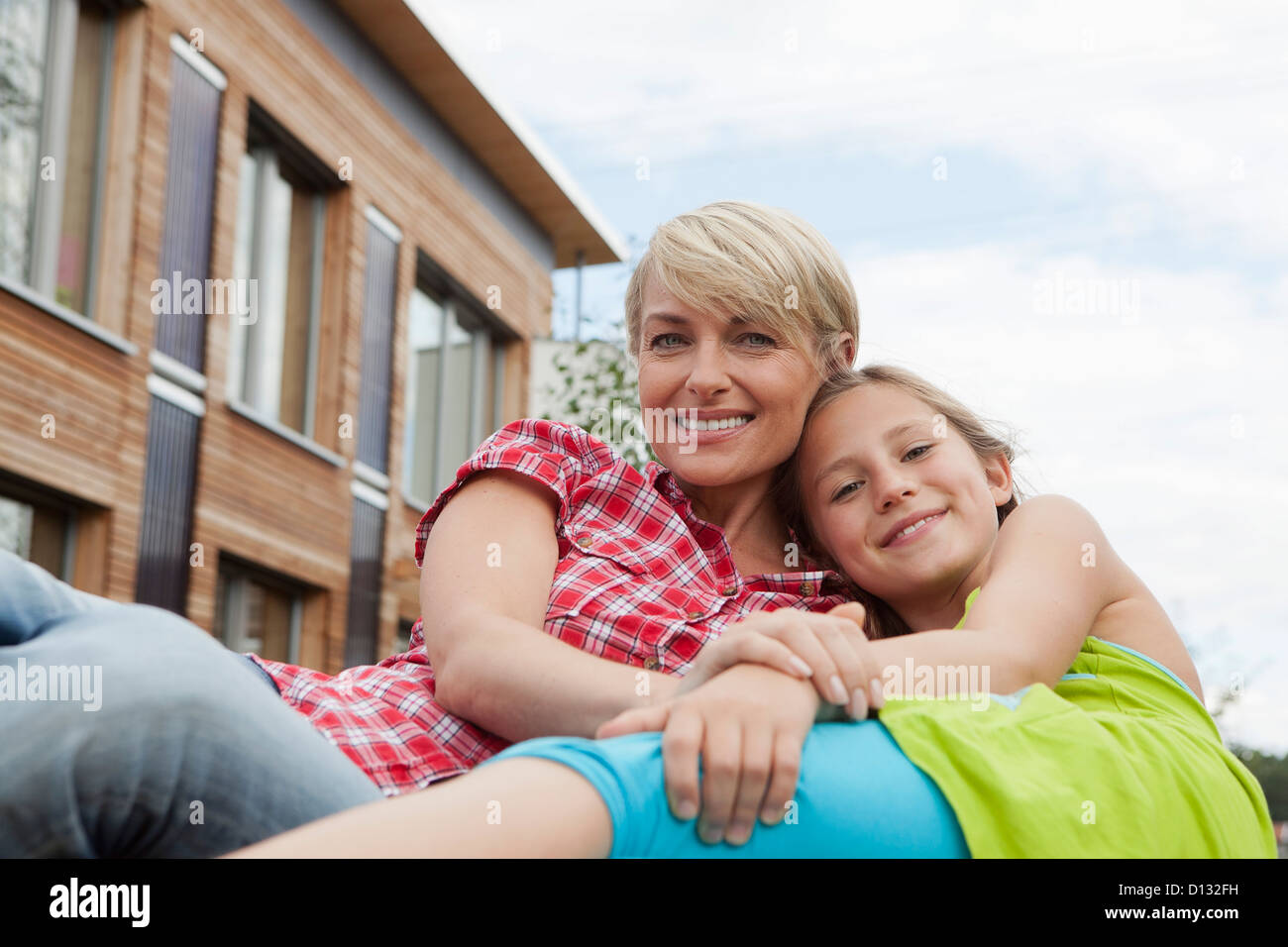 Germany, Bavaria, Nuremberg, Mother and daughter smiling, portrait ...