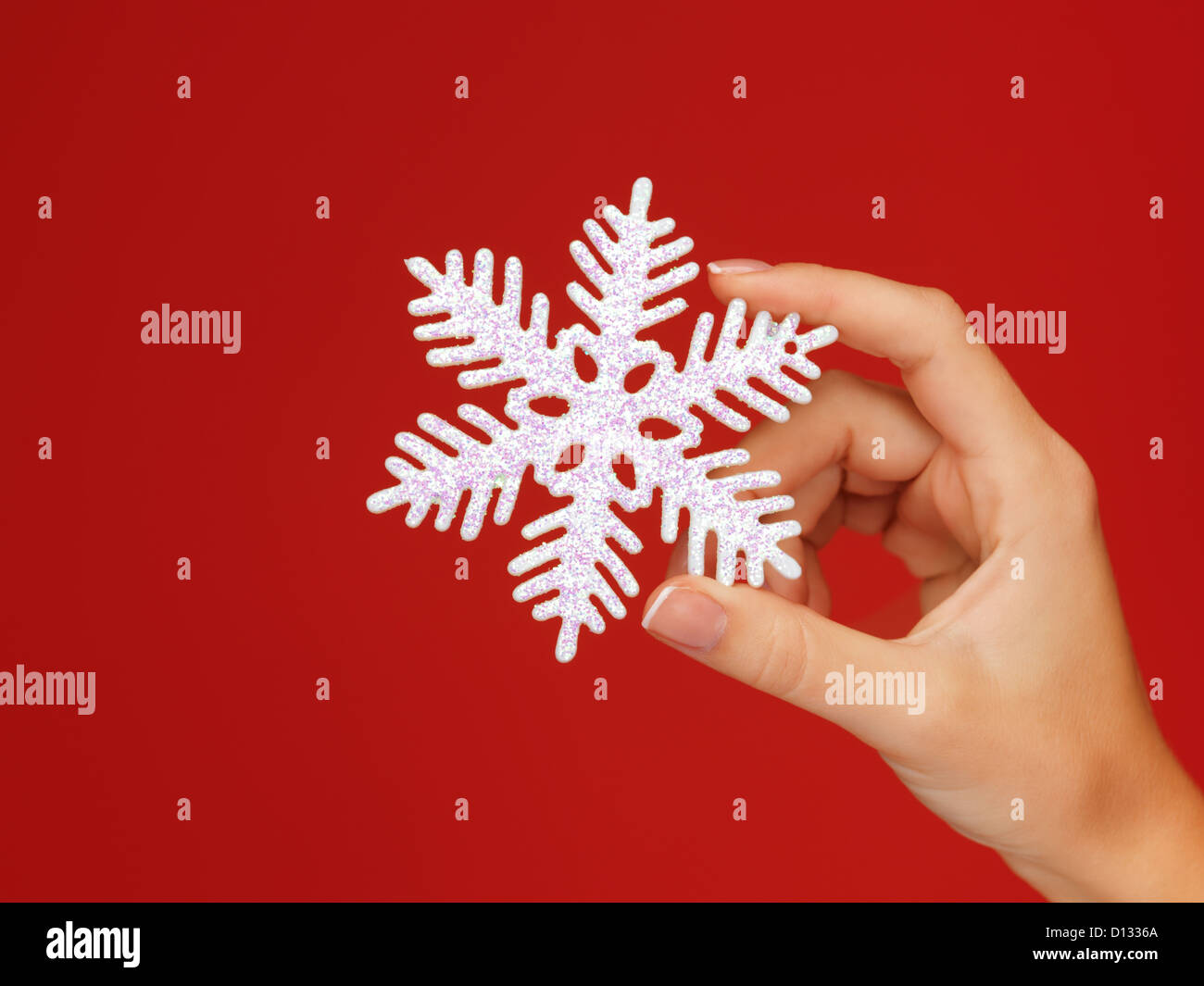 woman's hands holding a snowflake Stock Photo - Alamy