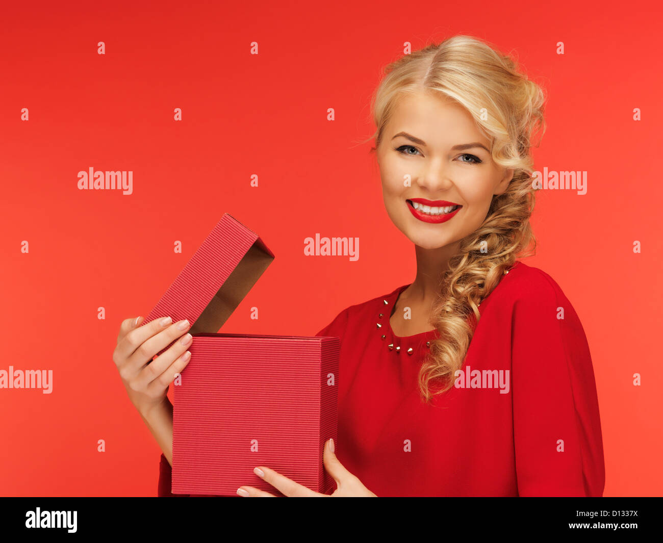 lovely woman in red dress with opened gift box Stock Photo - Alamy