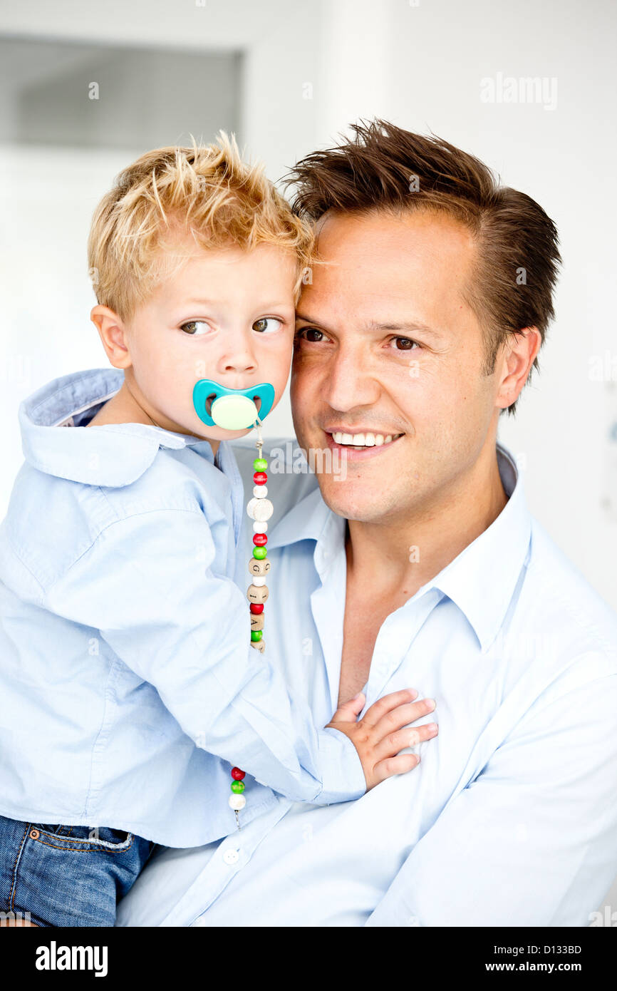 Germany, Son carrying pacifier, close-up Stock Photo - Alamy