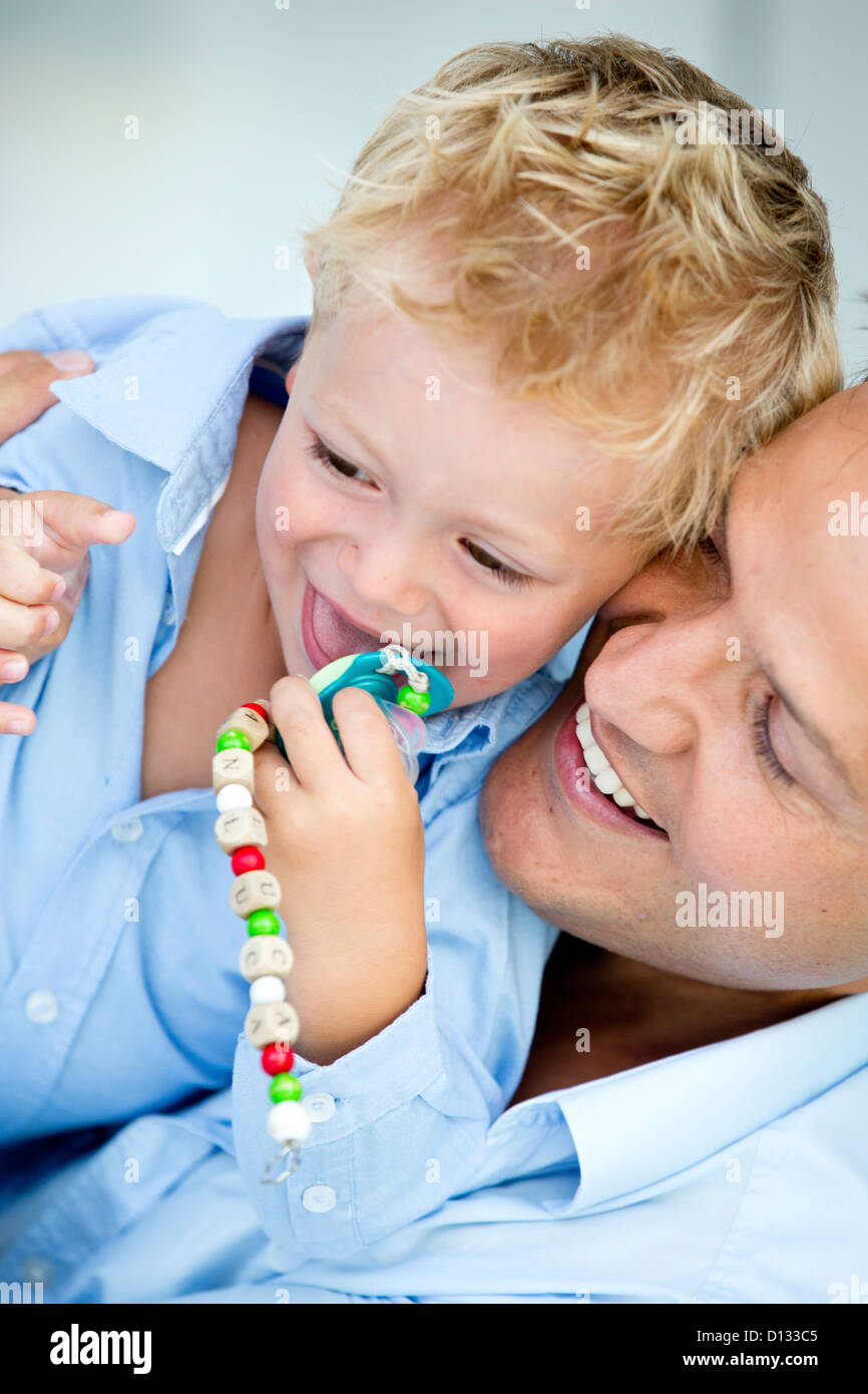 Germany, Father carrying son, smiling Stock Photo - Alamy