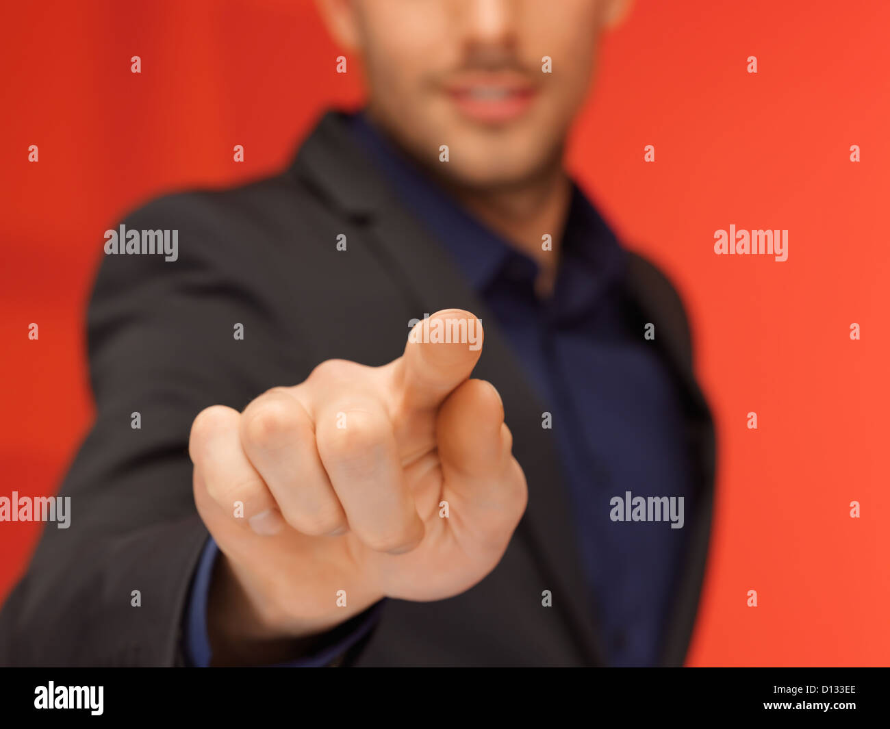 handsome man in suit pressing virtual button Stock Photo - Alamy