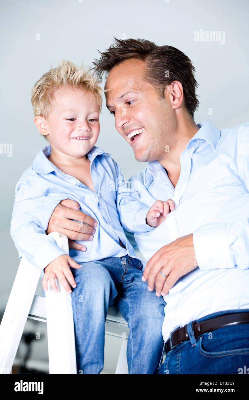 Father son standing on ladder hi-res stock photography and images - Alamy