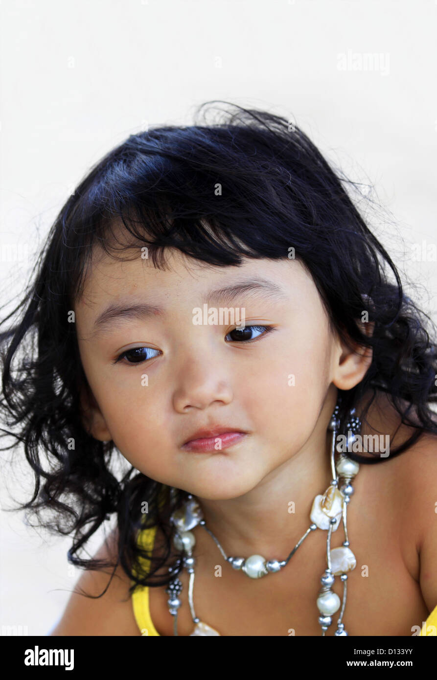 Portrait of the beautiful small Asian girl. Indonesia. Java Stock Photo ...