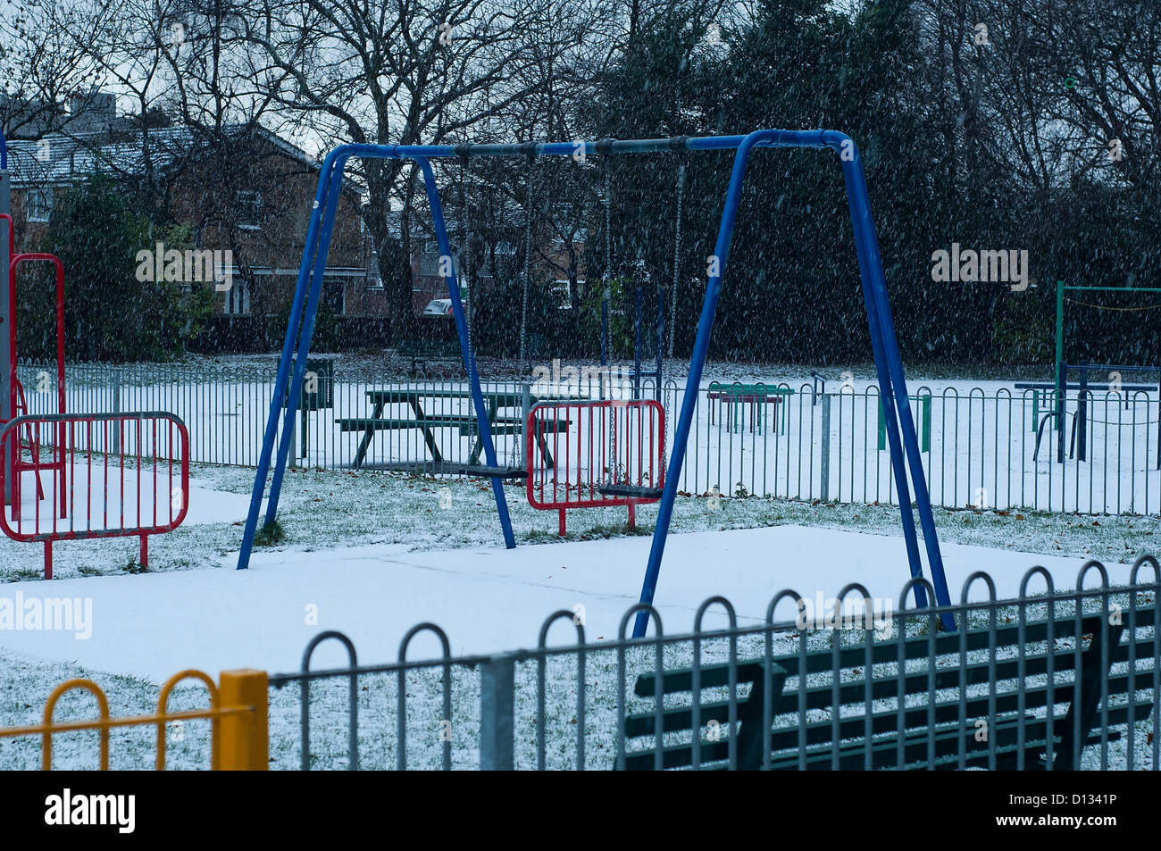 Swing and snow Stock Photo - Alamy