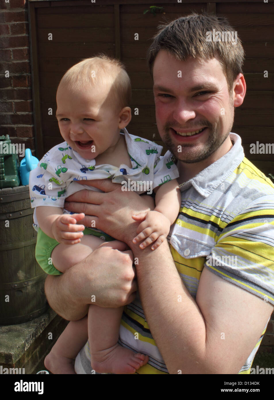 A young boy with his father Stock Photo - Alamy