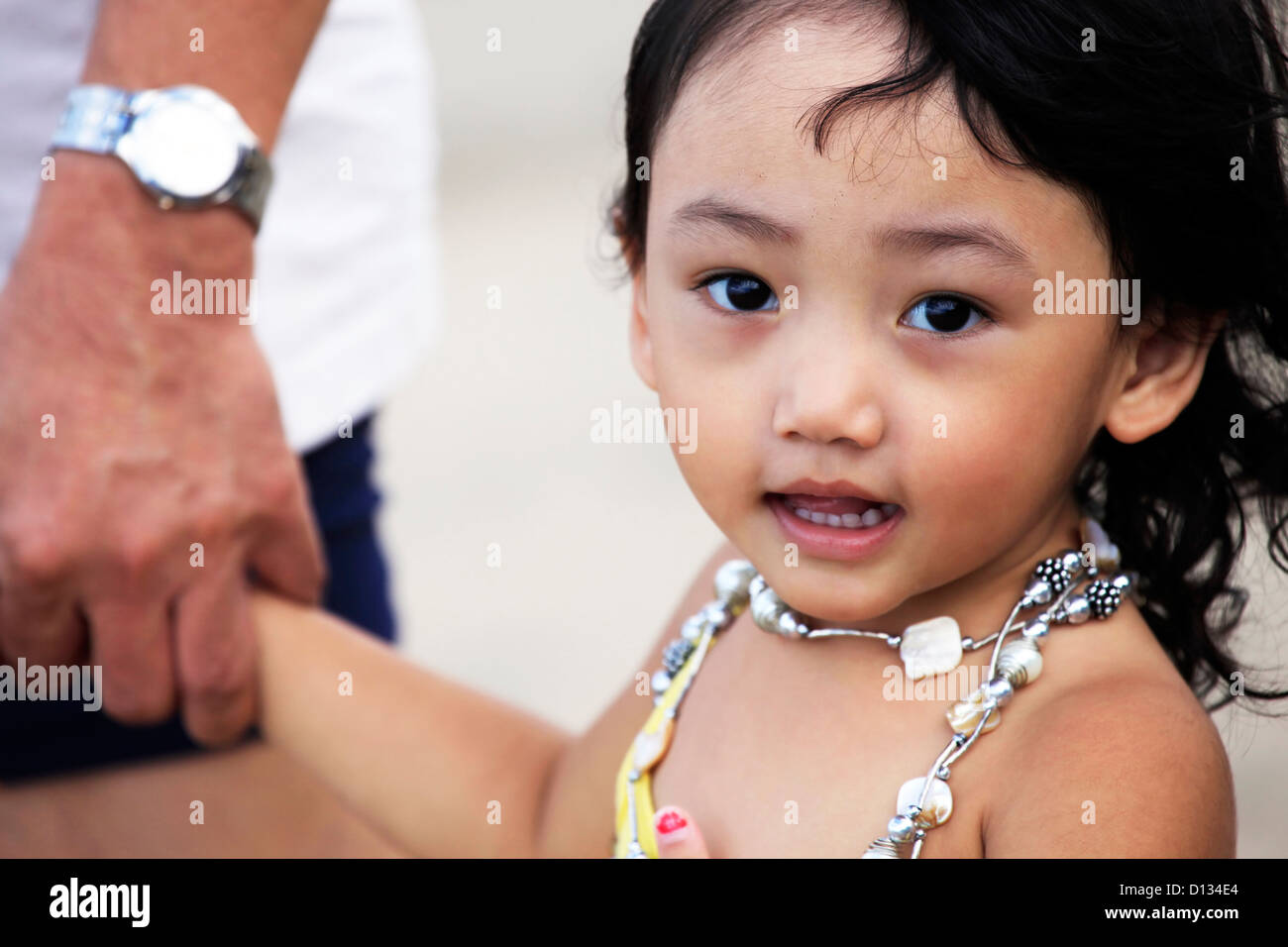 Portrait of the beautiful small Asian girl with father. Indonesia. Java ...