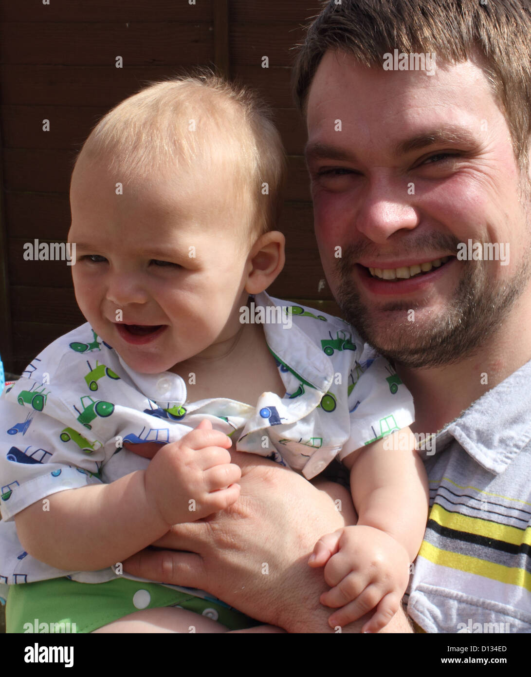 A young boy with his father Stock Photo - Alamy