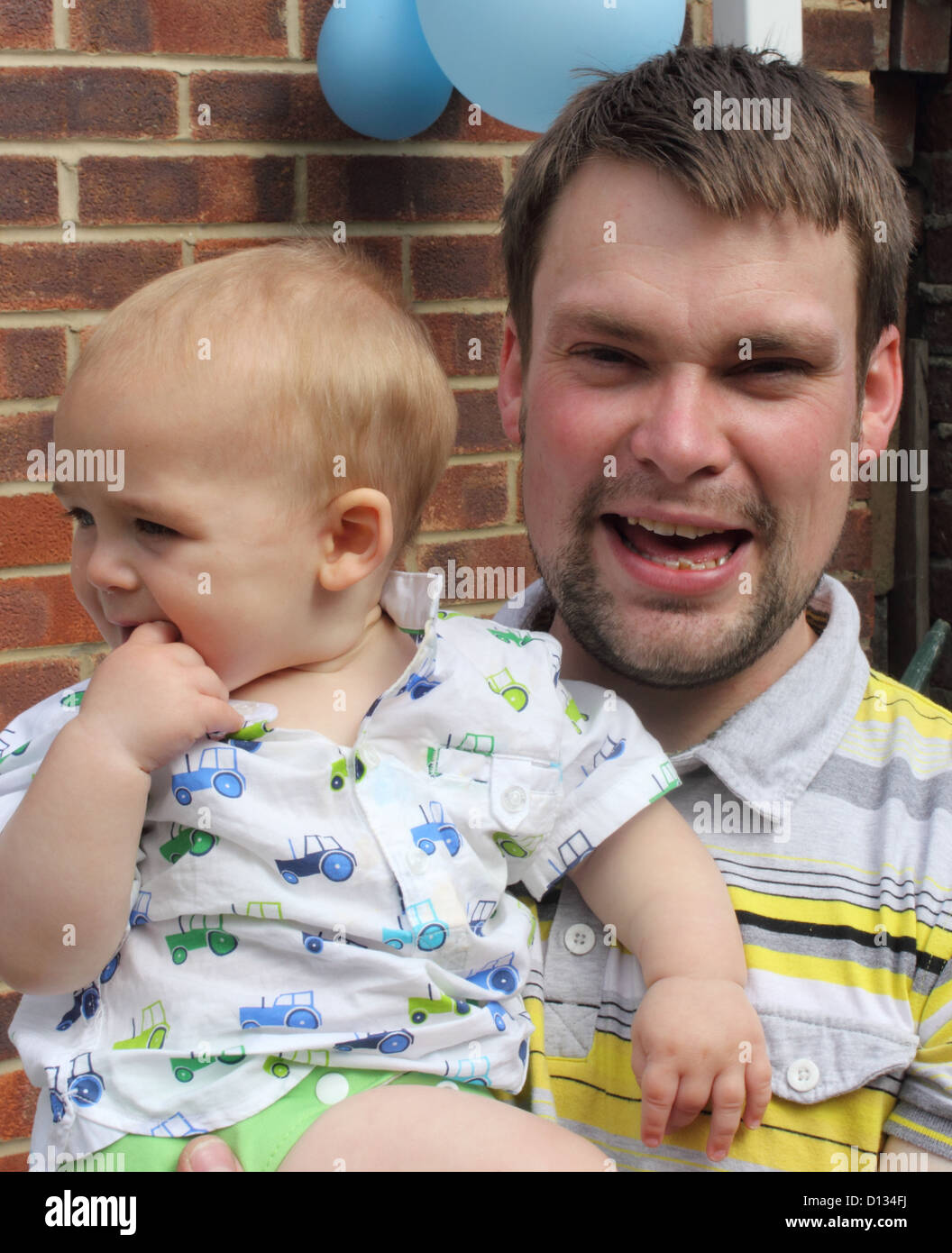 A young boy with his father Stock Photo - Alamy