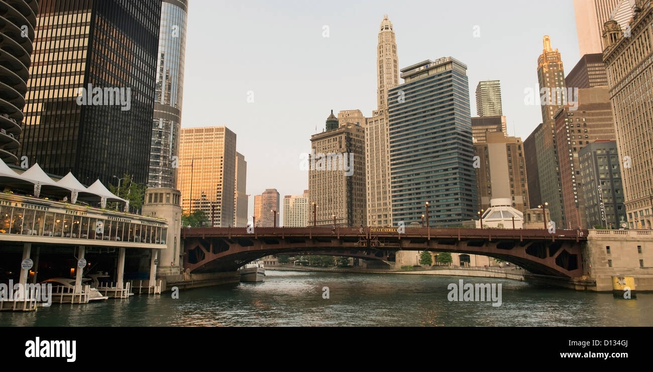 A Bridge Crossing The Chicago River With Skyscrapers In The Background ...