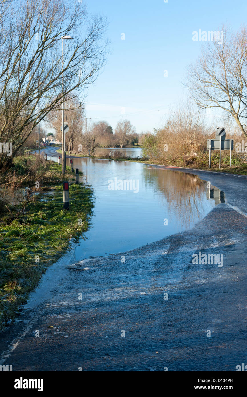 The flooded road on the Ouse washes at Earith Cambridgeshire UK. This ...