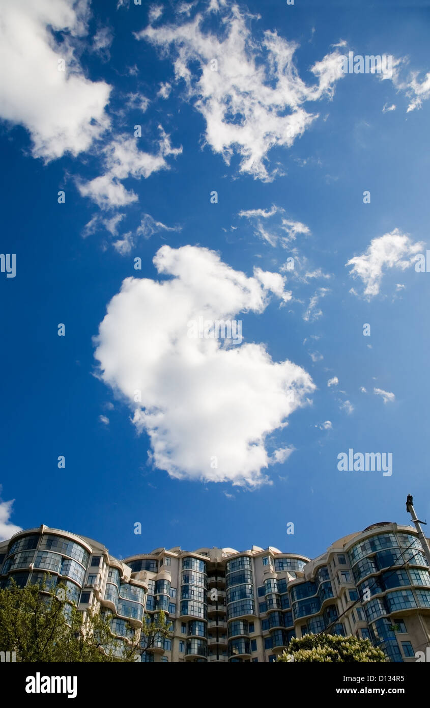Generic modern building and cloudy sky Stock Photo - Alamy