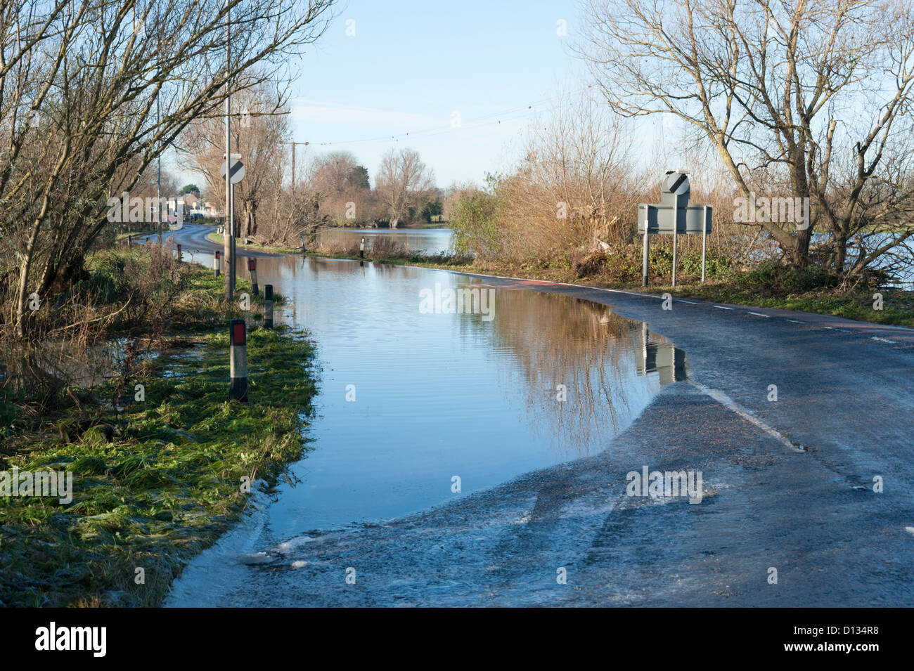 The flooded road on the Ouse washes at Earith Cambridgeshire UK. This ...