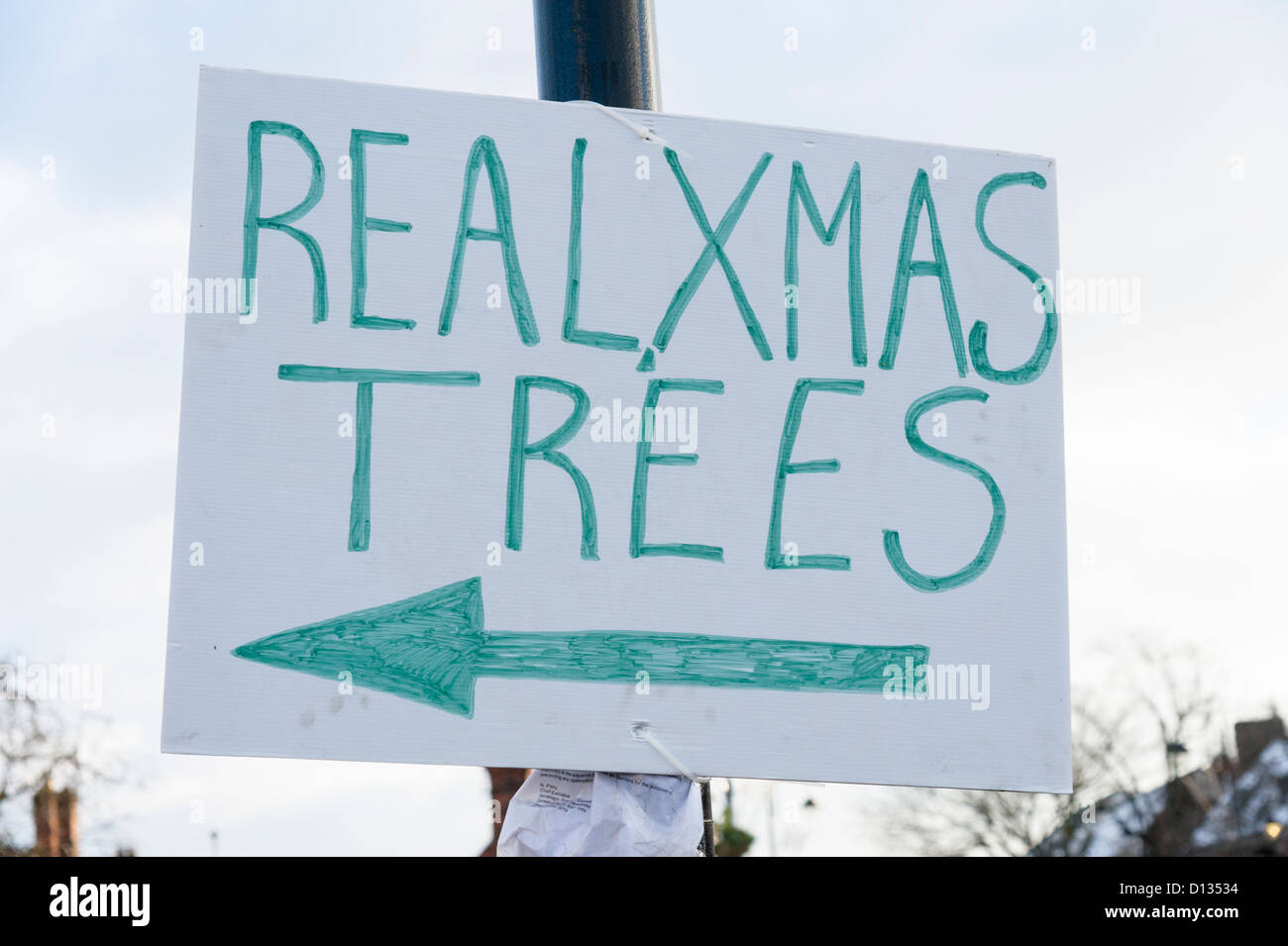 Sign advertising real xmas trees for sale hand written Stock Photo - Alamy
