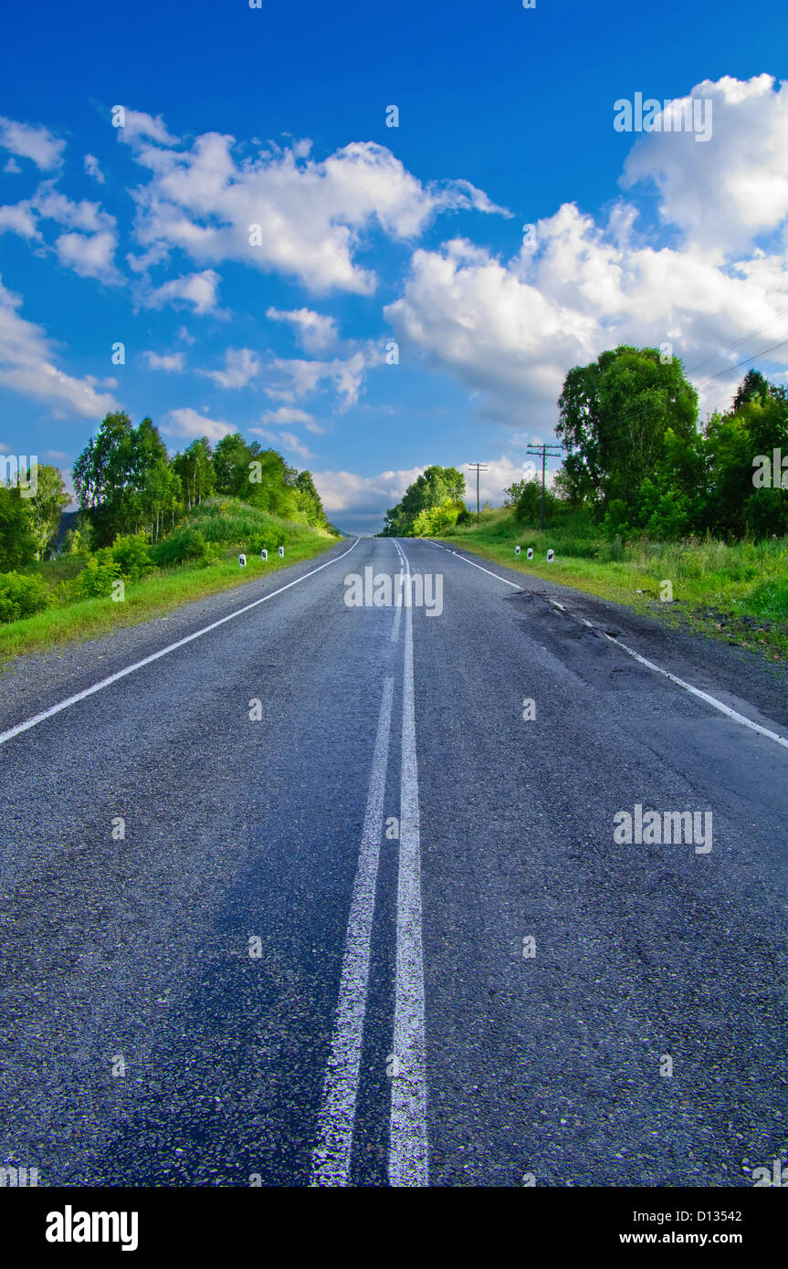 asphalt road receding into the distance Stock Photo - Alamy