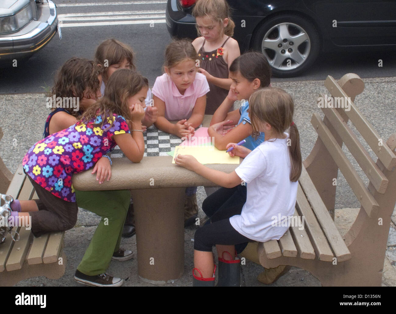 Group of girls together at a neighborhood day camp having a serious ...