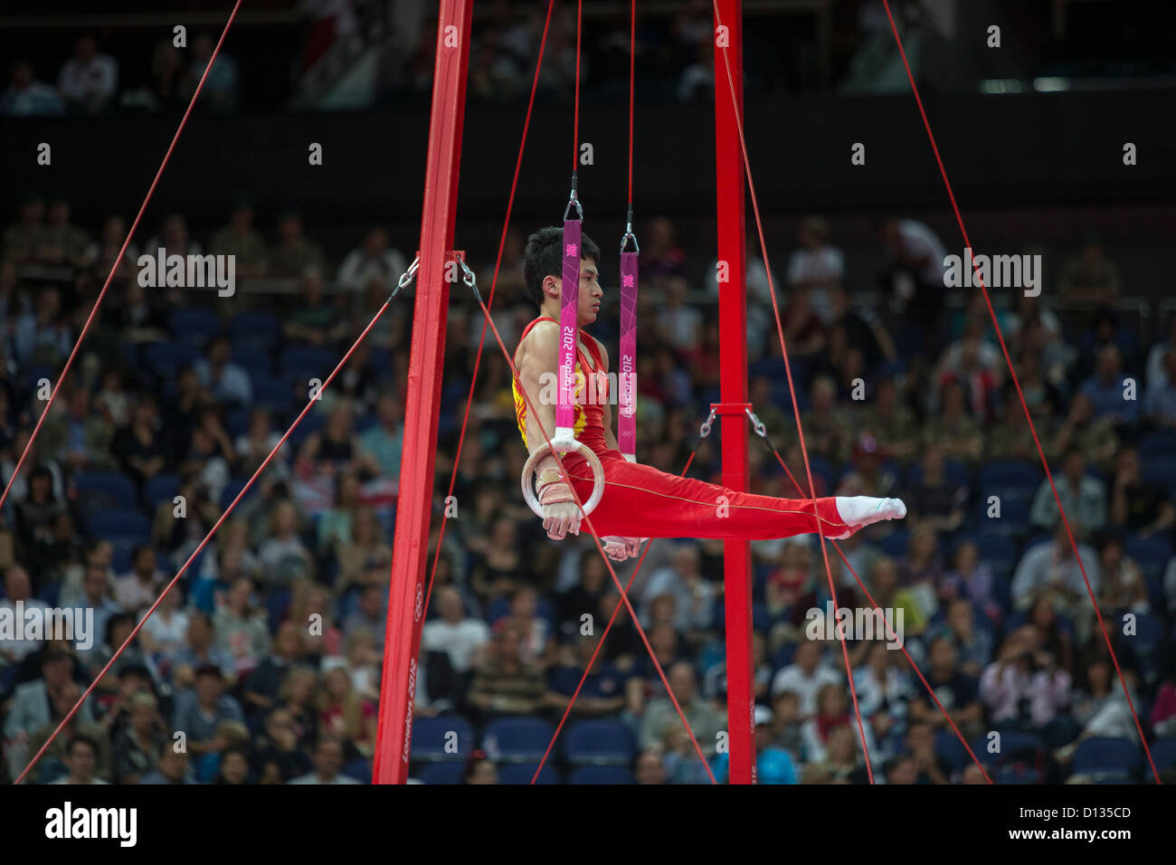 Zhe Feng (CHN) competing on the Rings during the Men's Team Final at t ...