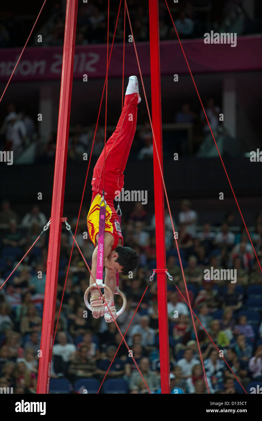 Zhe Feng (CHN) competing on the Rings during the Men's Team Final at t ...