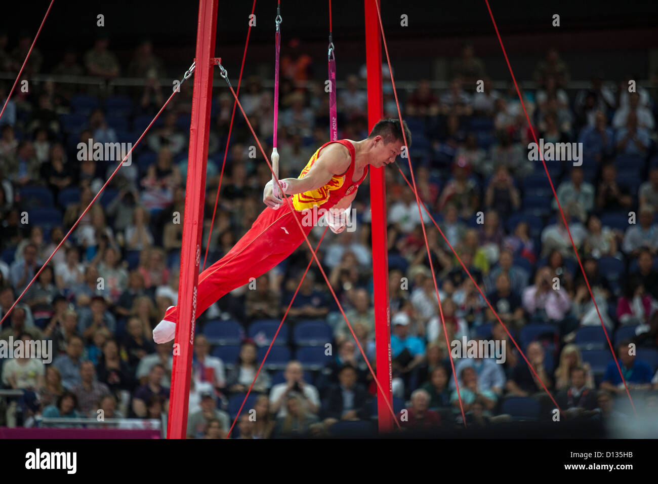 Yibing Chen (CHN) competing on the Rings during the Men's Team Final at ...